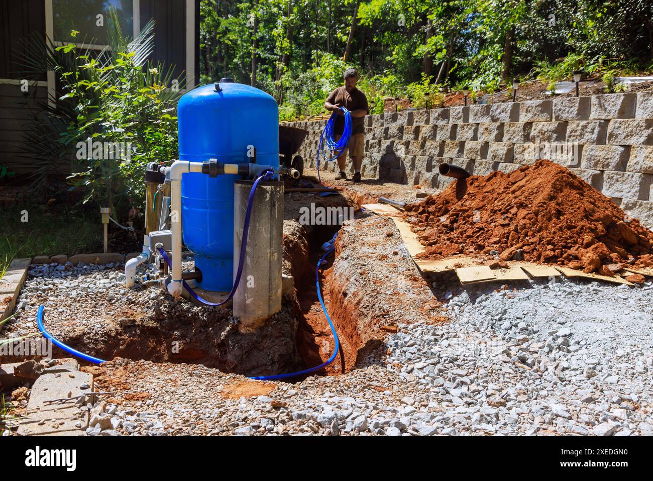 In trench, PVC pipe is ready to connect to home well water system Stock ...