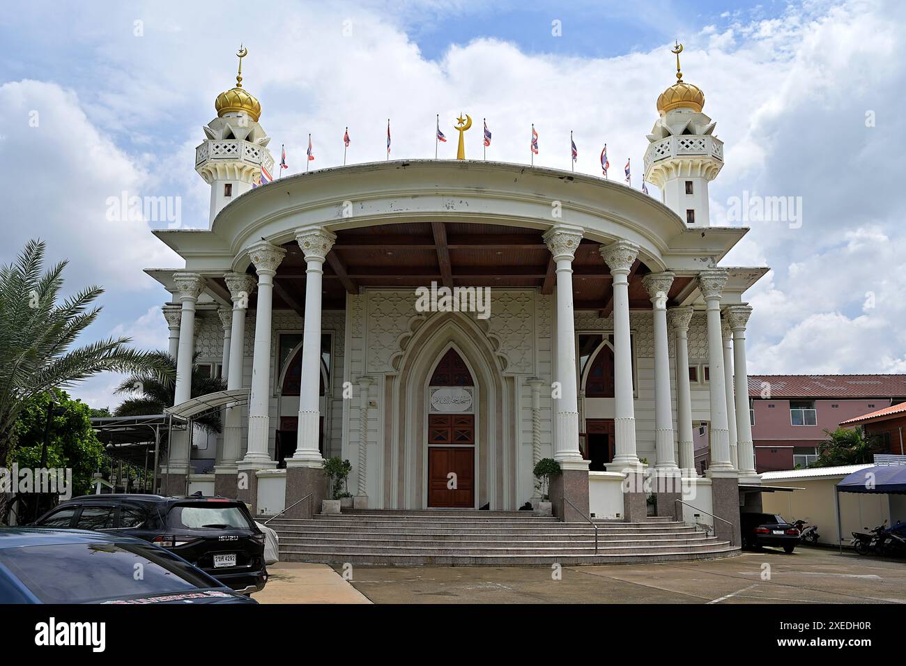 Elegant white archway and entrance to Rahmatul Islam Mosque along Muban ...