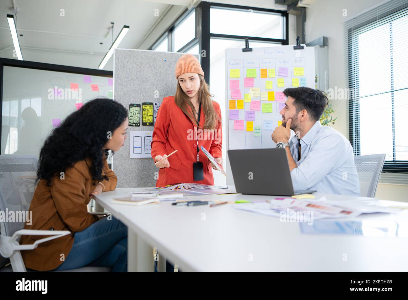 Multiethnic young business people working together in modern office ...