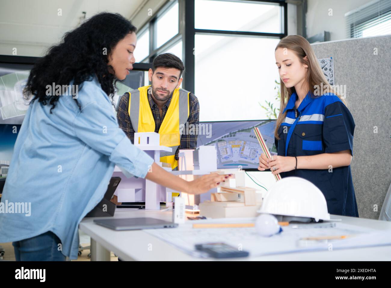 Engineers, architects, and designers collaborate to design a building ...