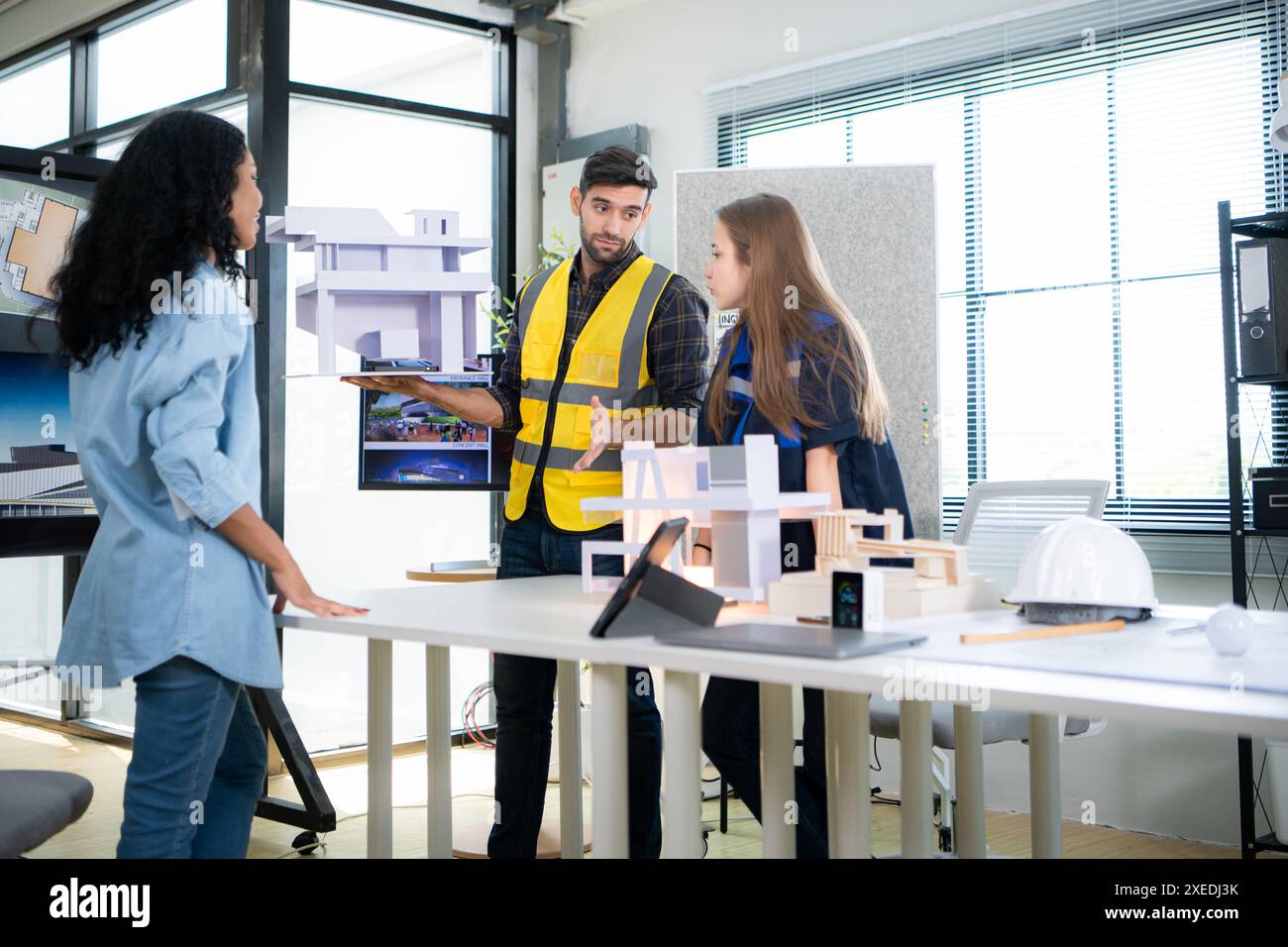 Engineers, architects, and designers collaborate to design a building ...