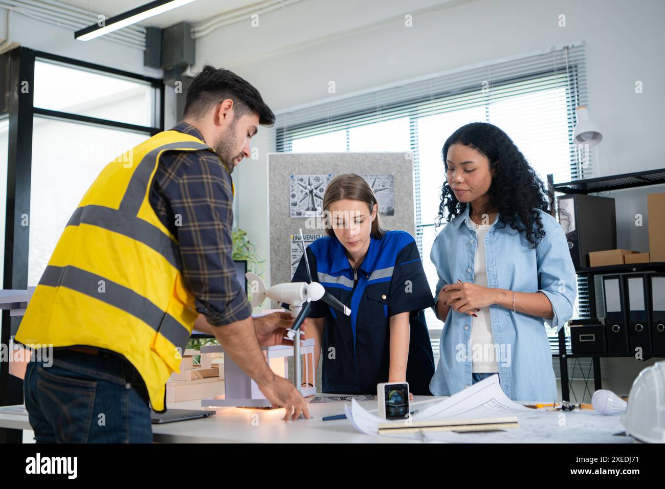 Engineers, architects, and designers collaborate to design a building ...