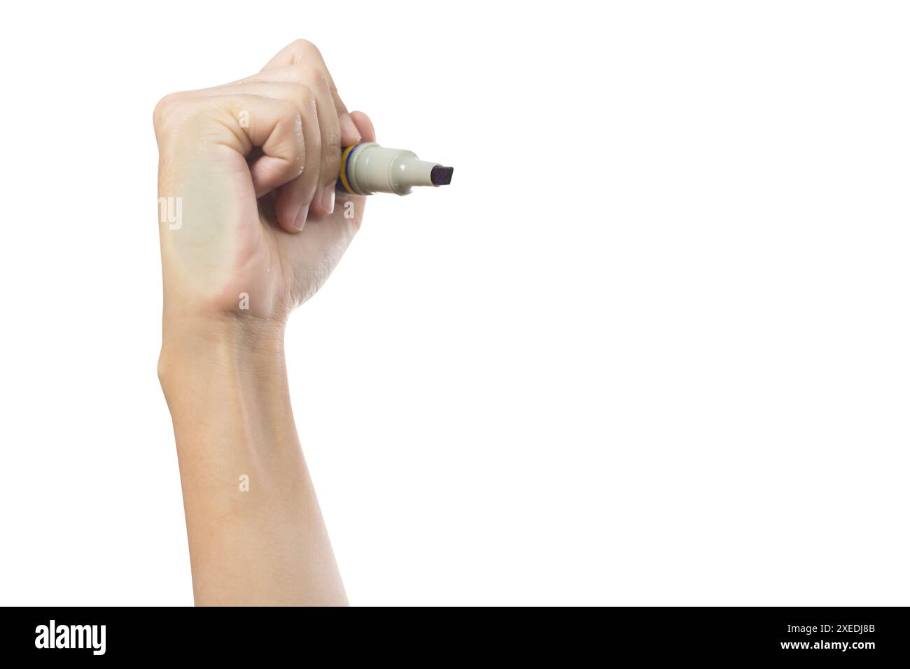Close-up of a hand holding a marker. A hand holding a marker against a ...