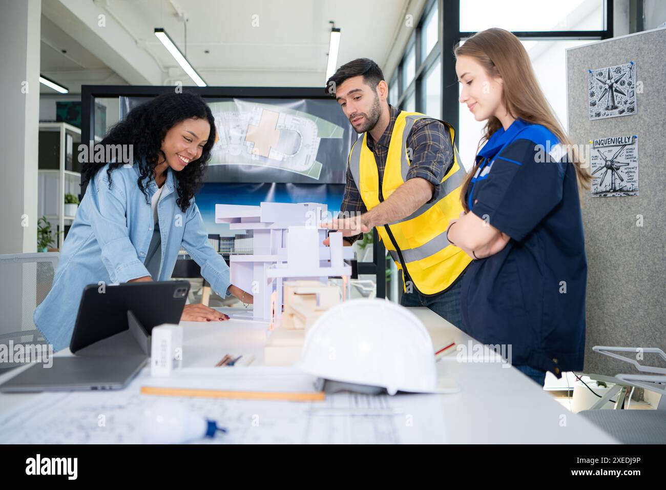 Engineers, architects, and designers collaborate to design a building ...