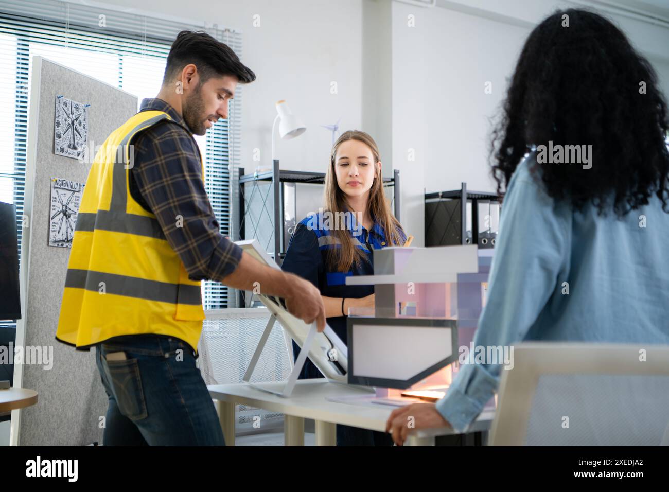 Engineers, architects, and designers collaborate to design a building ...