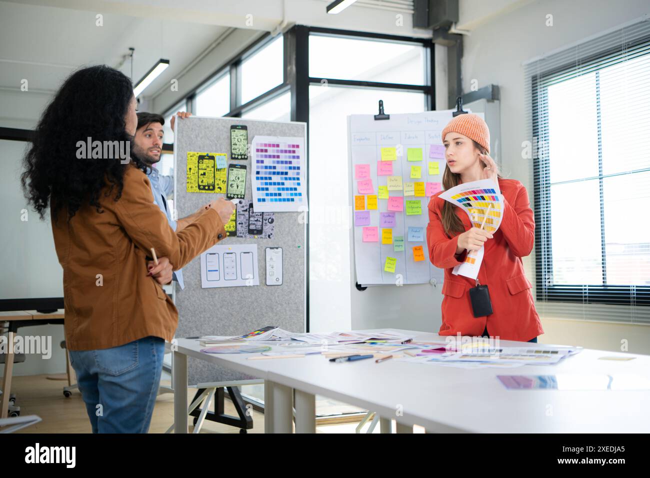 Multiethnic young business people working together in modern office ...