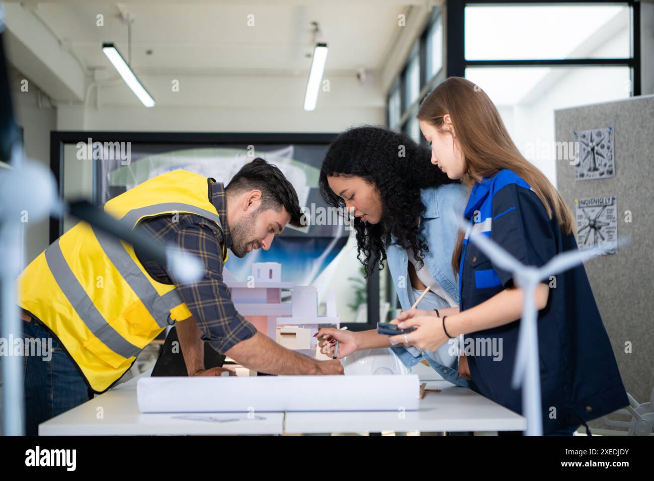 Engineers, architects, and designers collaborate to design a building ...