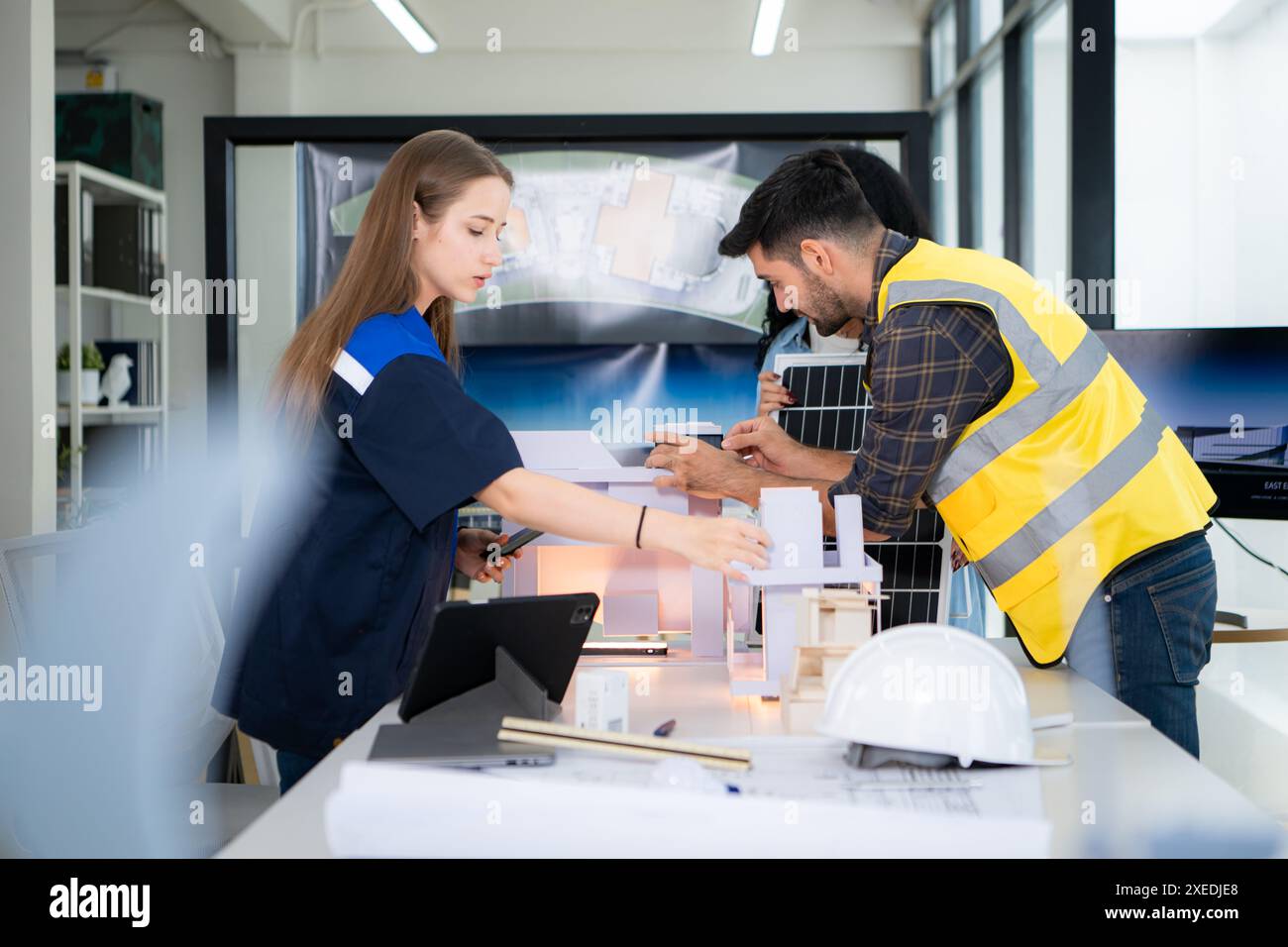 Engineers, architects, and designers collaborate to design a building ...