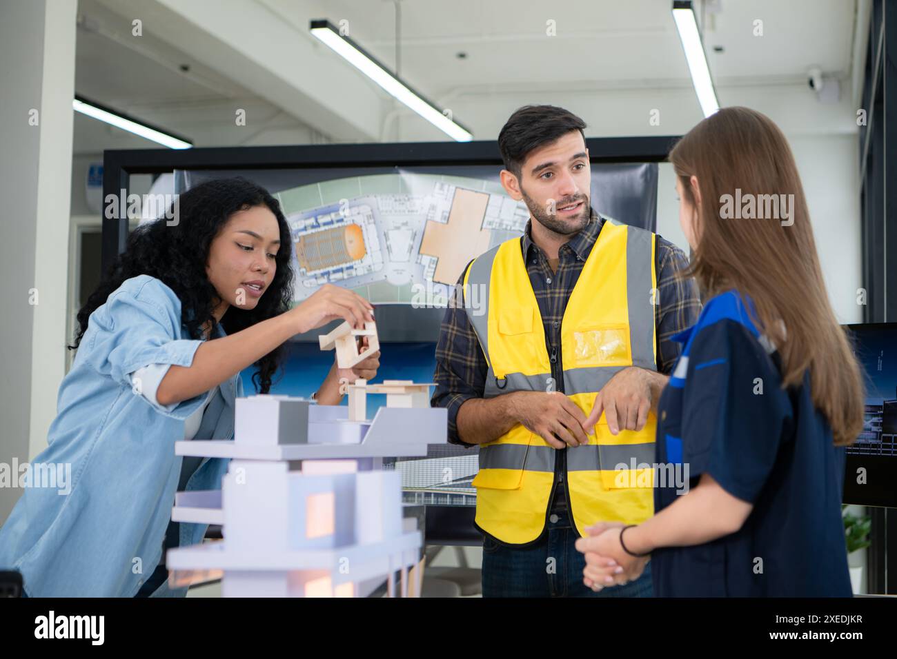 Engineers, architects, and designers collaborate to design a building ...
