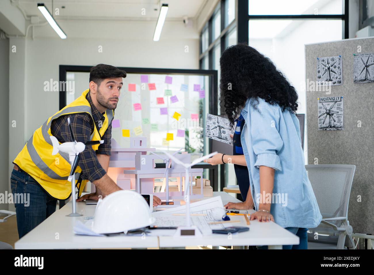 Engineers, architects, and designers collaborate to design a building ...