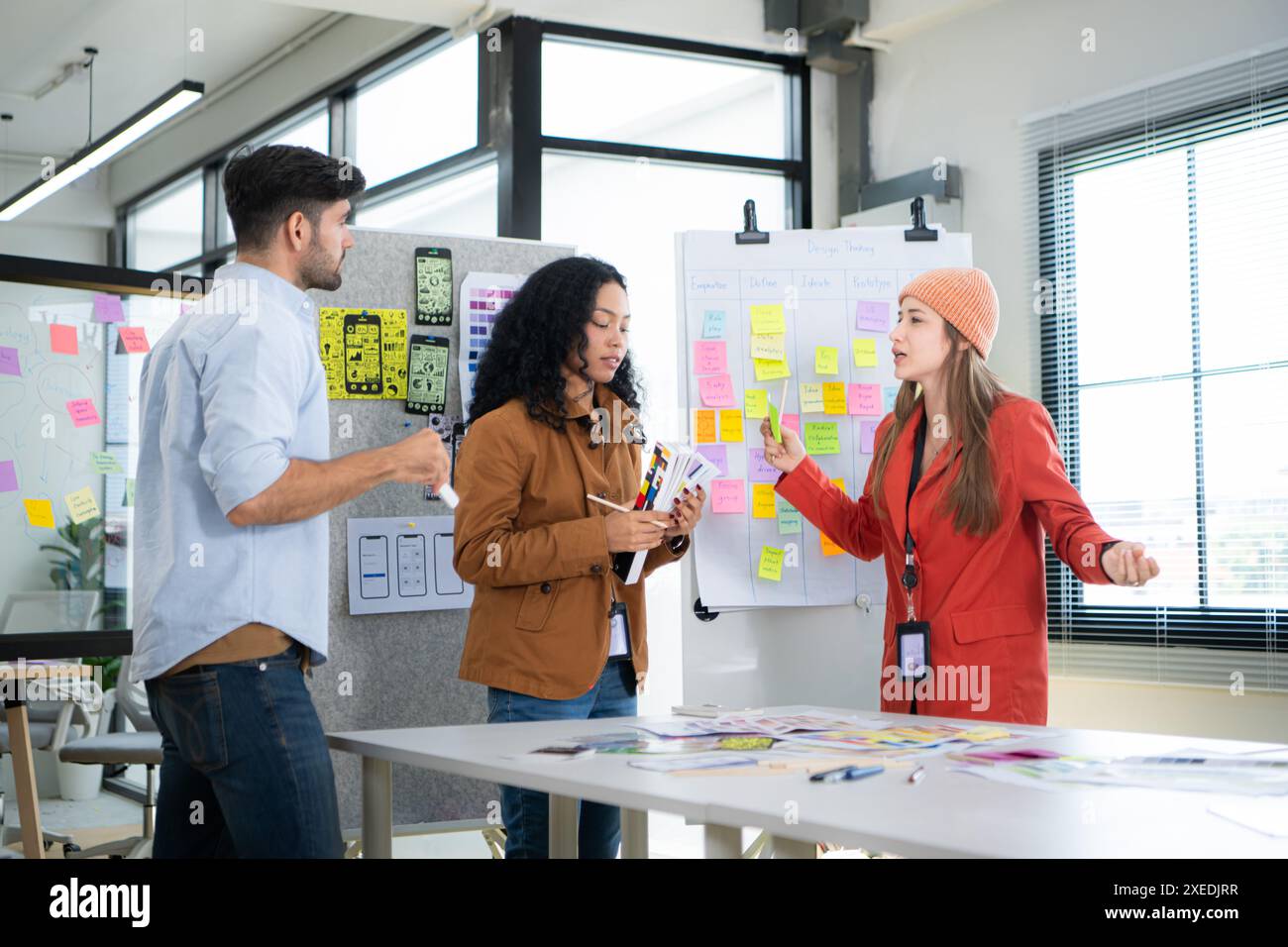 Multiethnic young business people working together in modern office ...