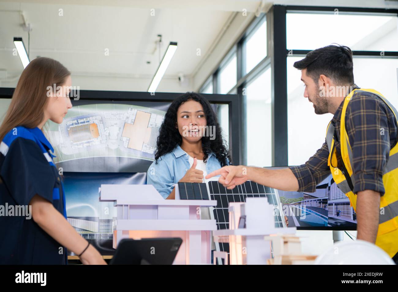 Engineers, architects, and designers collaborate to design a building ...