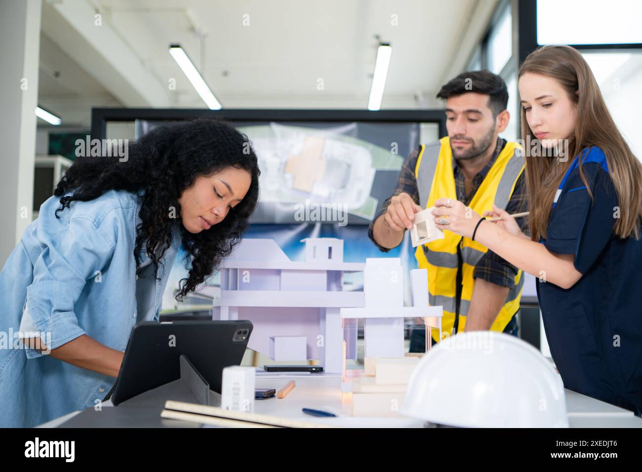 Engineers, architects, and designers collaborate to design a building ...