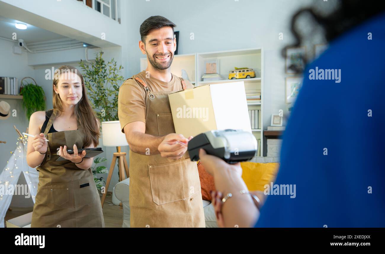 Small business owner sign to receive the product on board from the ...