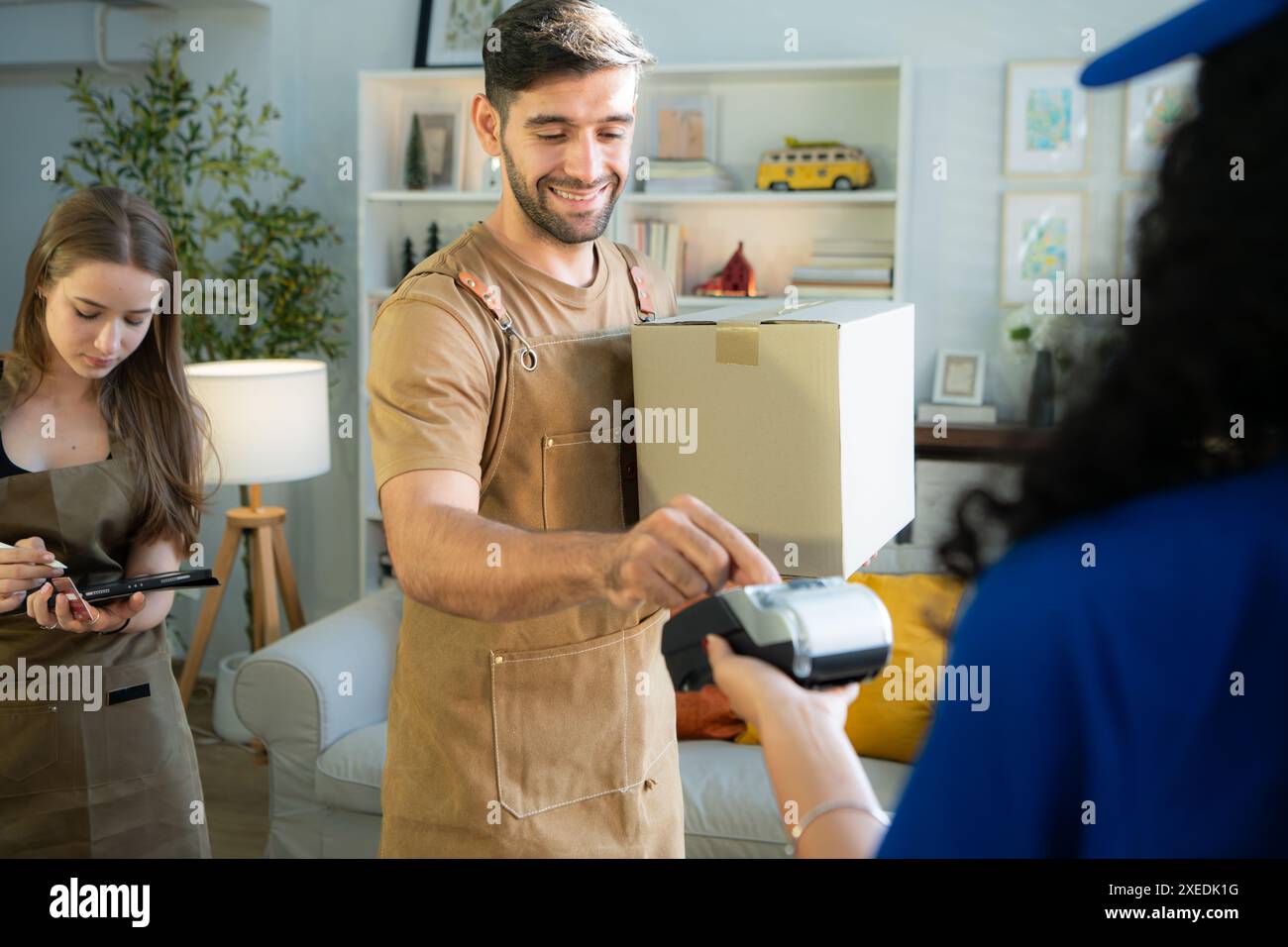 Small business owner sign to receive the product on board from the ...