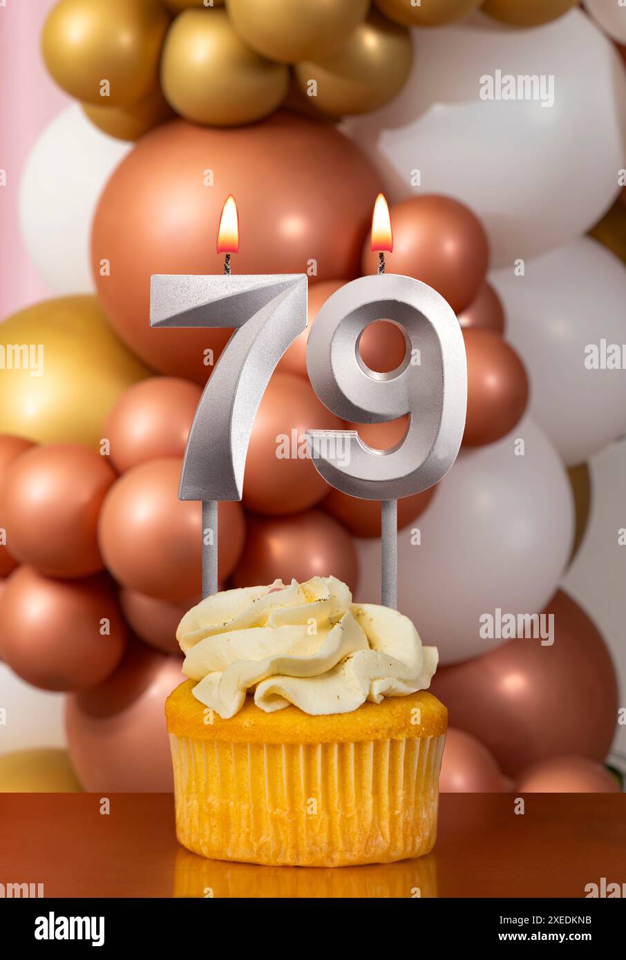 Cupcake with birthday candle on balloons background - Number 79 Stock ...