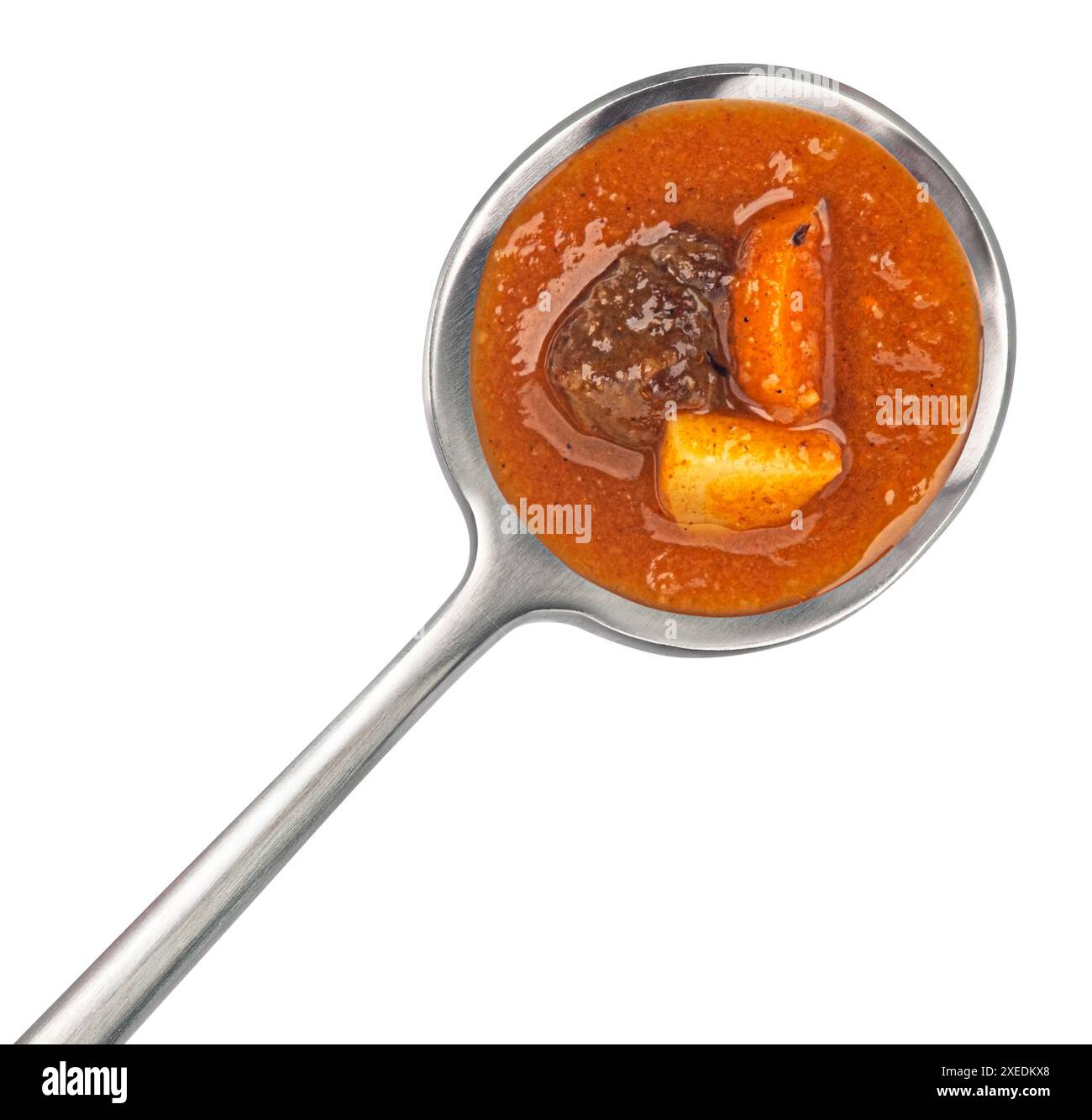 Beef stew in spoon isolated on white background, top view Stock Photo ...
