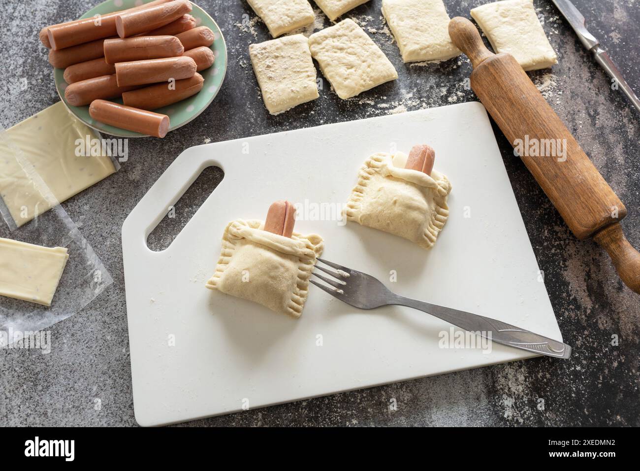 Cooking Easter rabbit-shaped buns puff pastry from sausage and cheese ...
