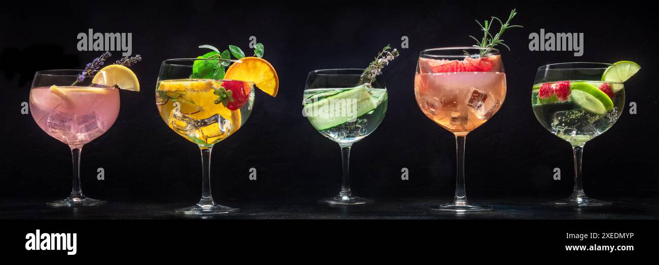 Fancy cocktails with fresh fruit. Gin and tonic drinks with ice at a ...