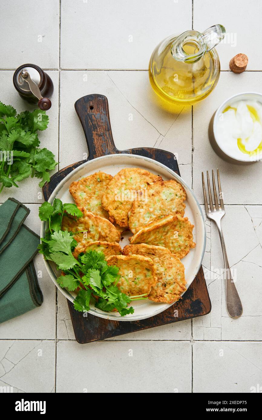 Vegetable zucchini fritters in with sour cream pepper and olive oil ...