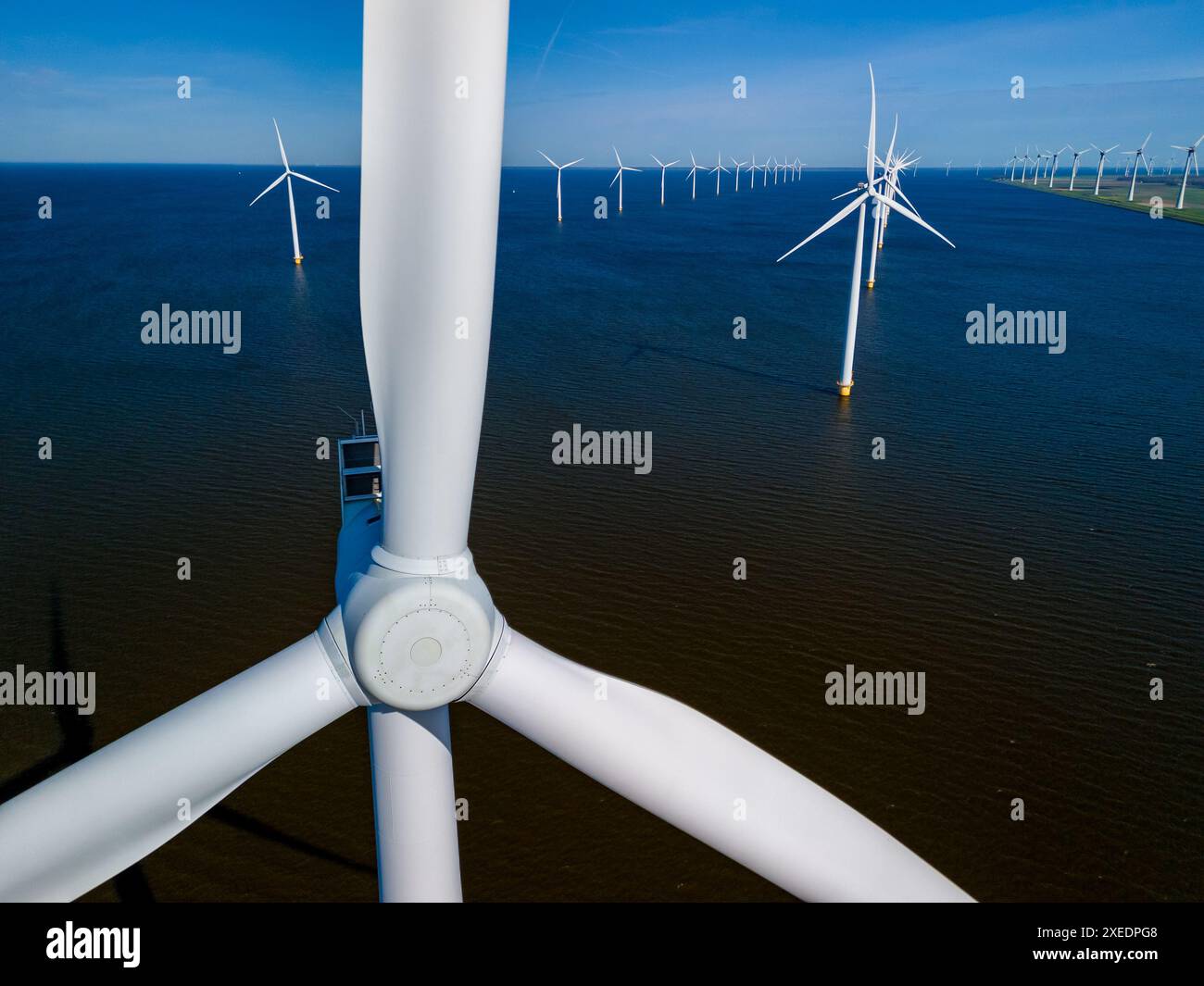 Wind farm in the ocean off the coast of Flevoland, Netherlands, with ...