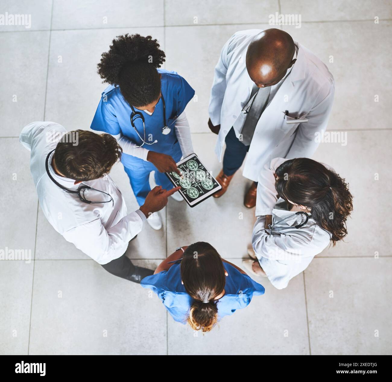 Top view, doctors and conversation with tablet screen, x ray and ...