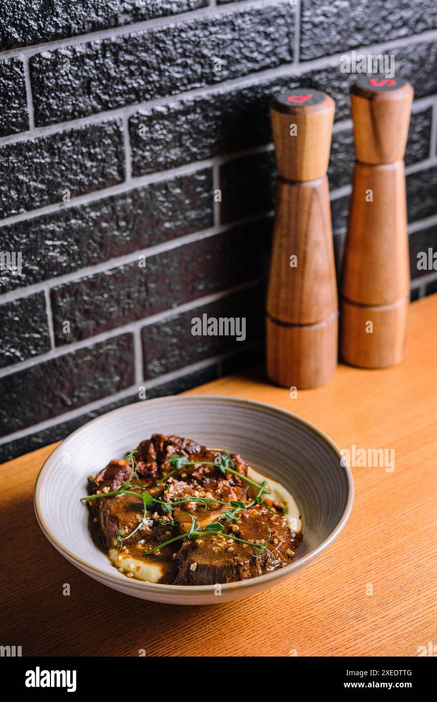 Traditional german braised veal cheeks in brown sauce with mashed ...