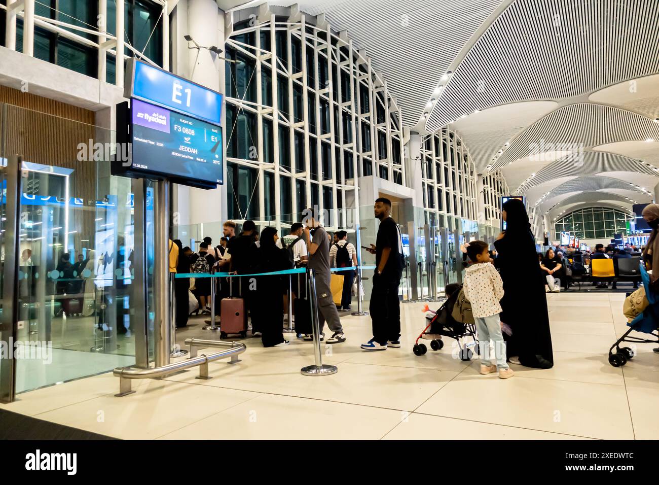 Tourists queuing in line at the airport gate in Istanbul airport (IST ...