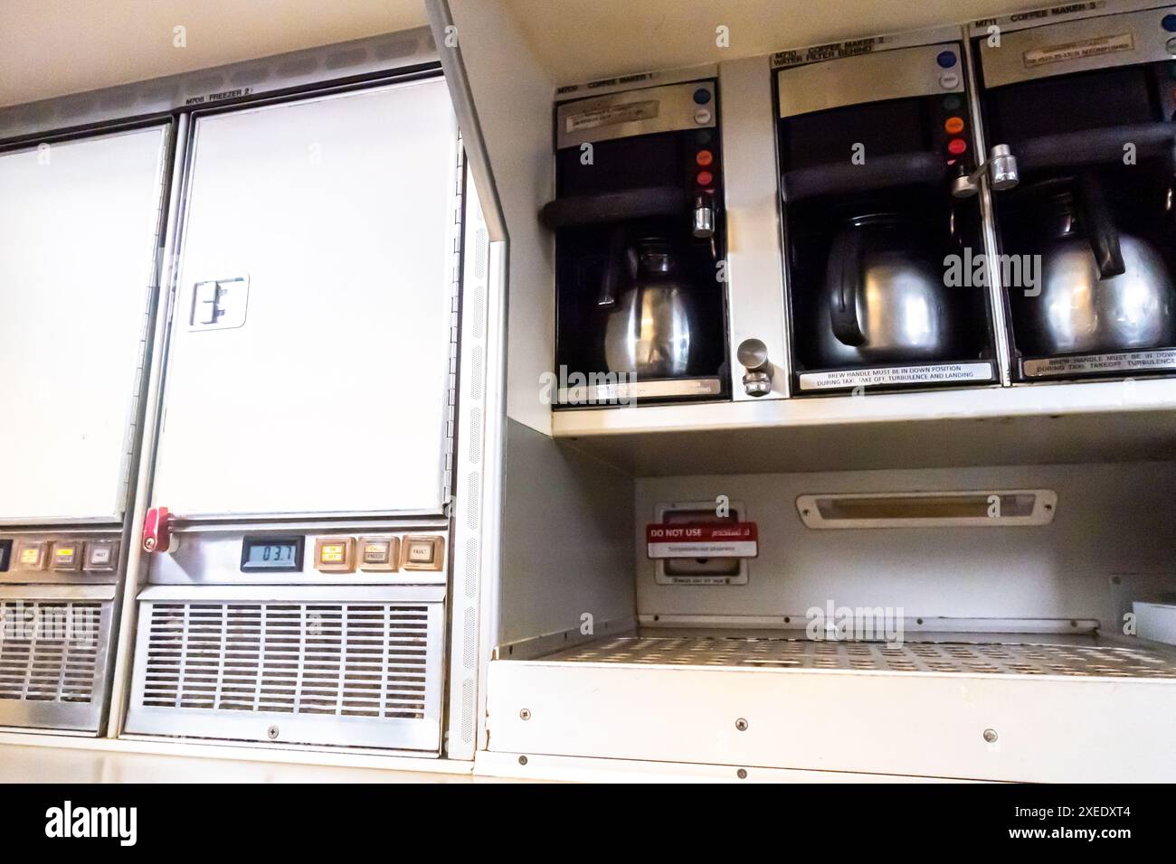Coffee makers,staff access on board in Boeing 787-10 Stock Photo - Alamy