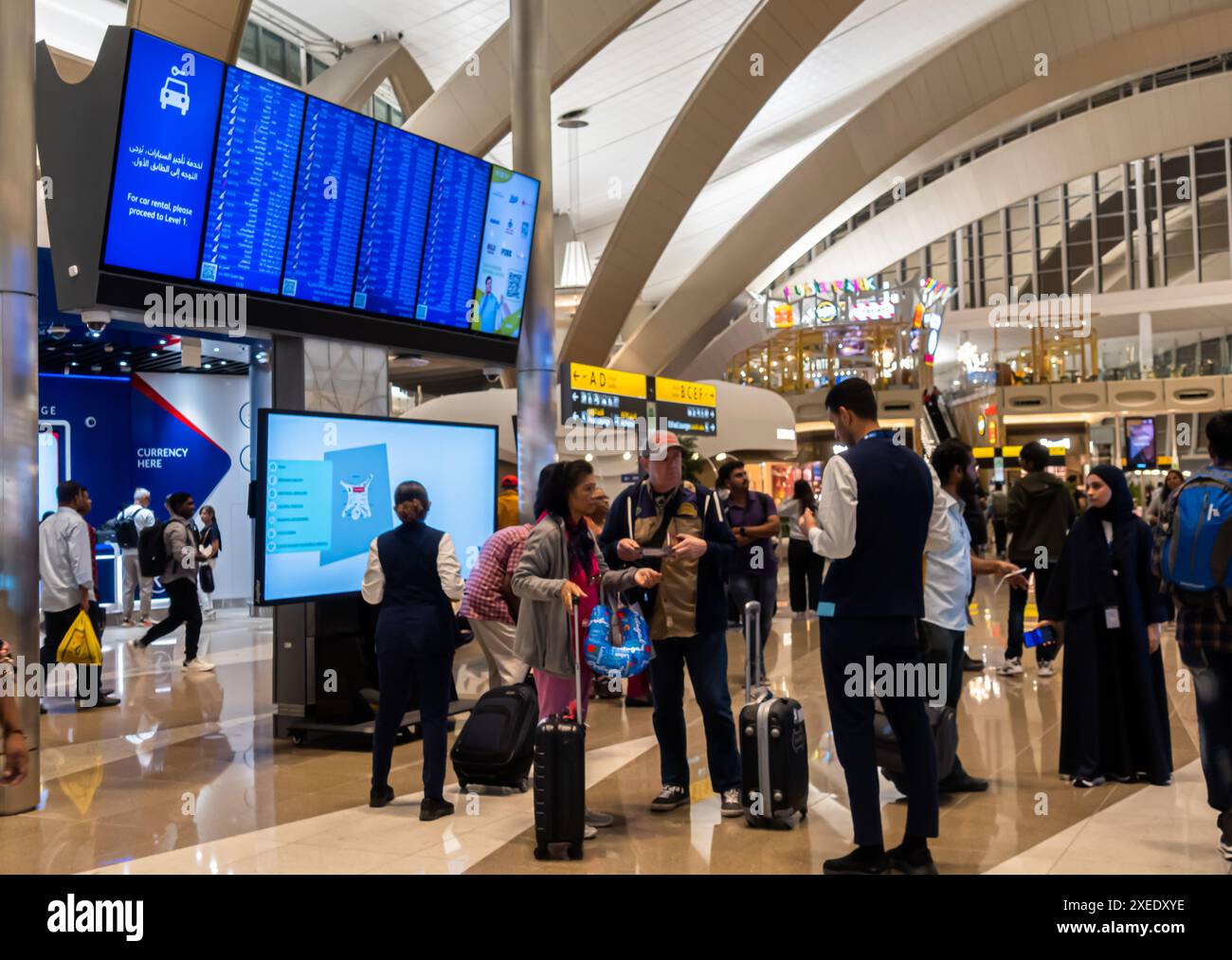 Tourists with luggage, sirport staff helping tourist, Zayed ...
