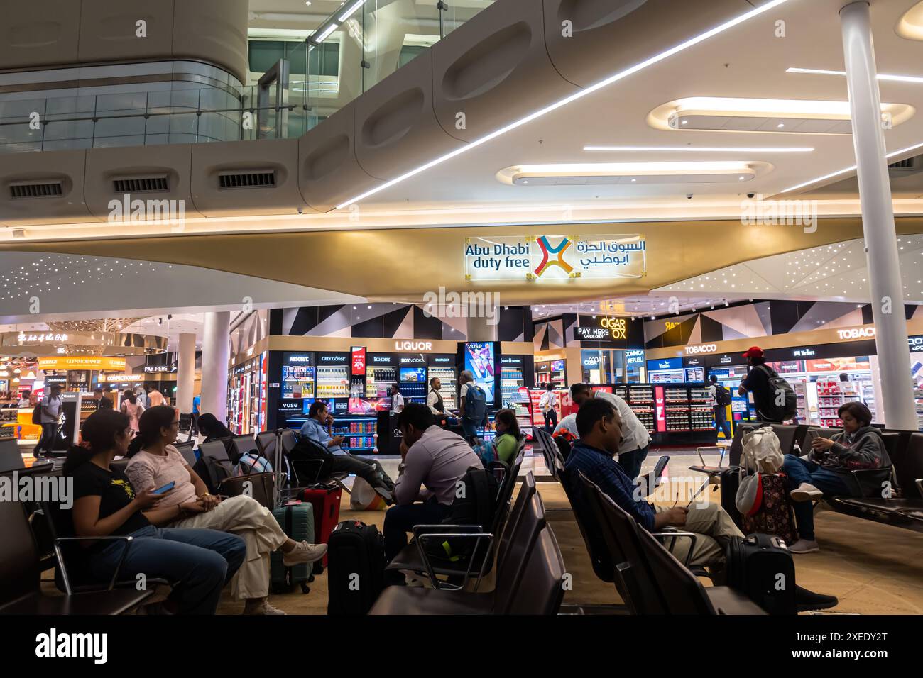 Tourists sitting in waiting area - Abu Dhabi Duty Free shop in Zayed ...