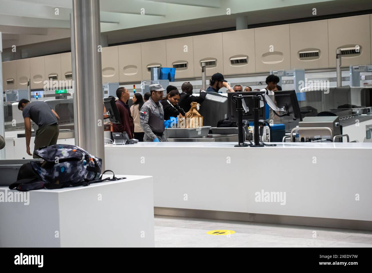 Security screening of carry-on luggage prior to the gates entrance ...