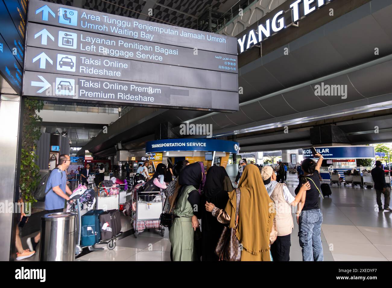 Tourists taking selfie inside the arrivals terminal in CGK Soekarno ...