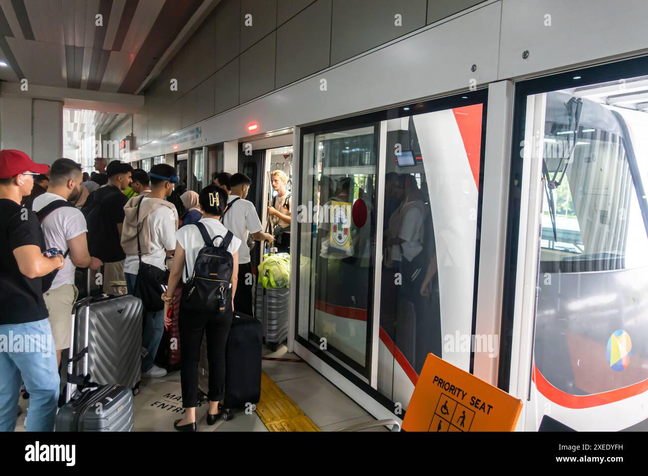 Commuters tourists boarding train at Manggarai station platform, Jakarta Indonesia Stock Photo ...