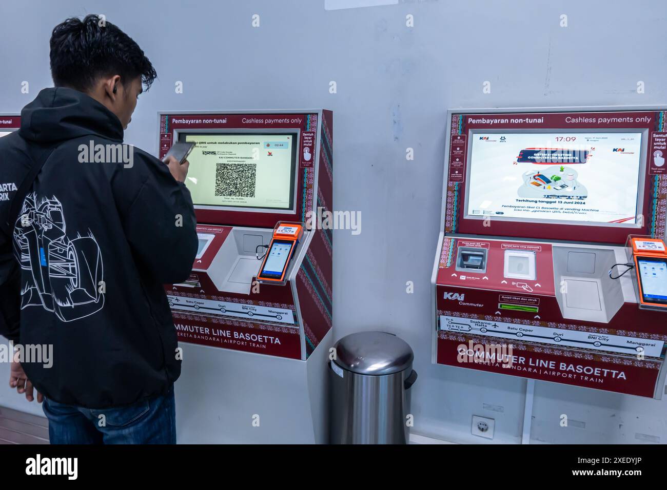 A man using KAI commuter line ticket cashless electronic machine to ...