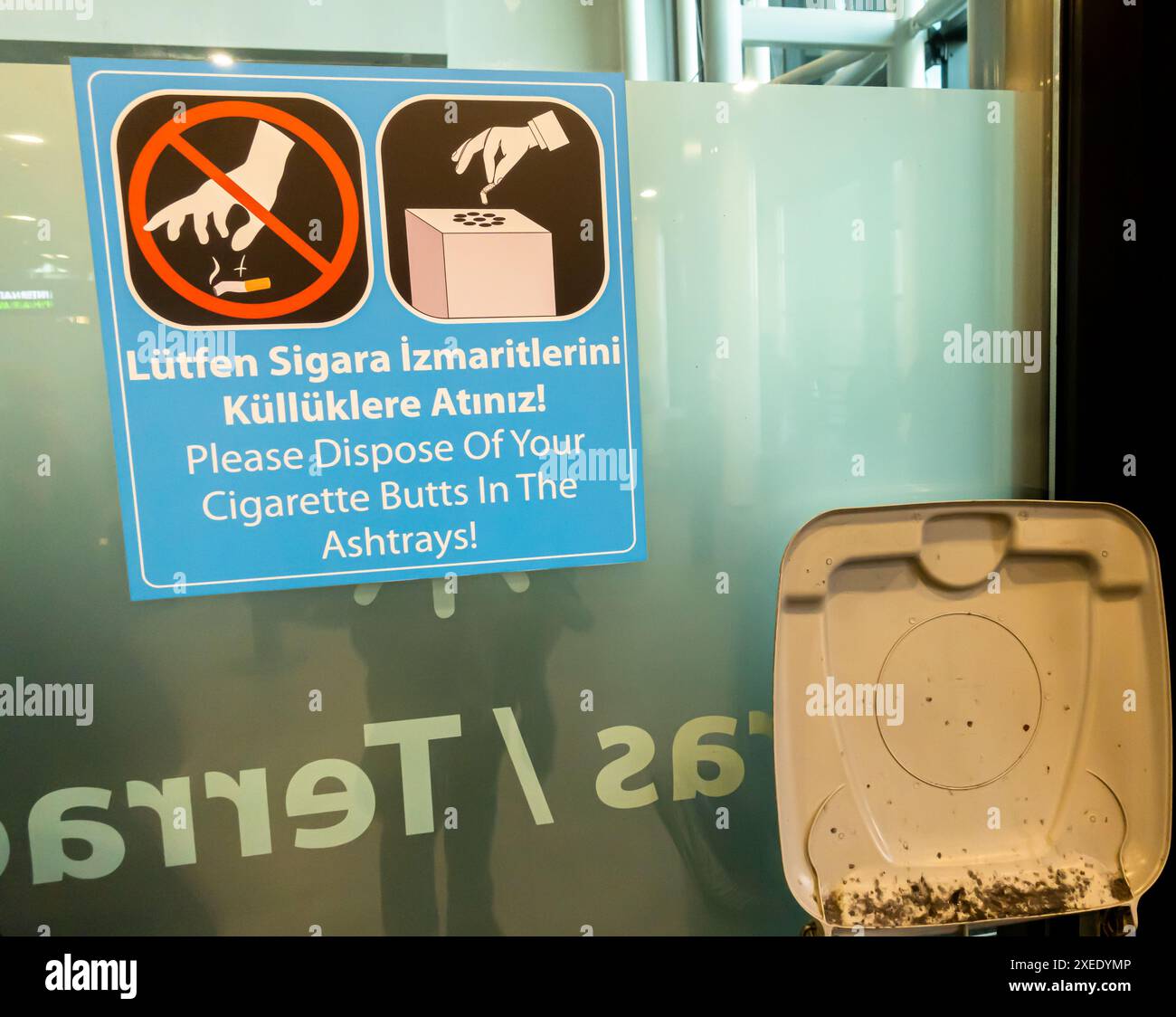 Bilingual Turkish English sign: Please dispose of your cigarette butts ...