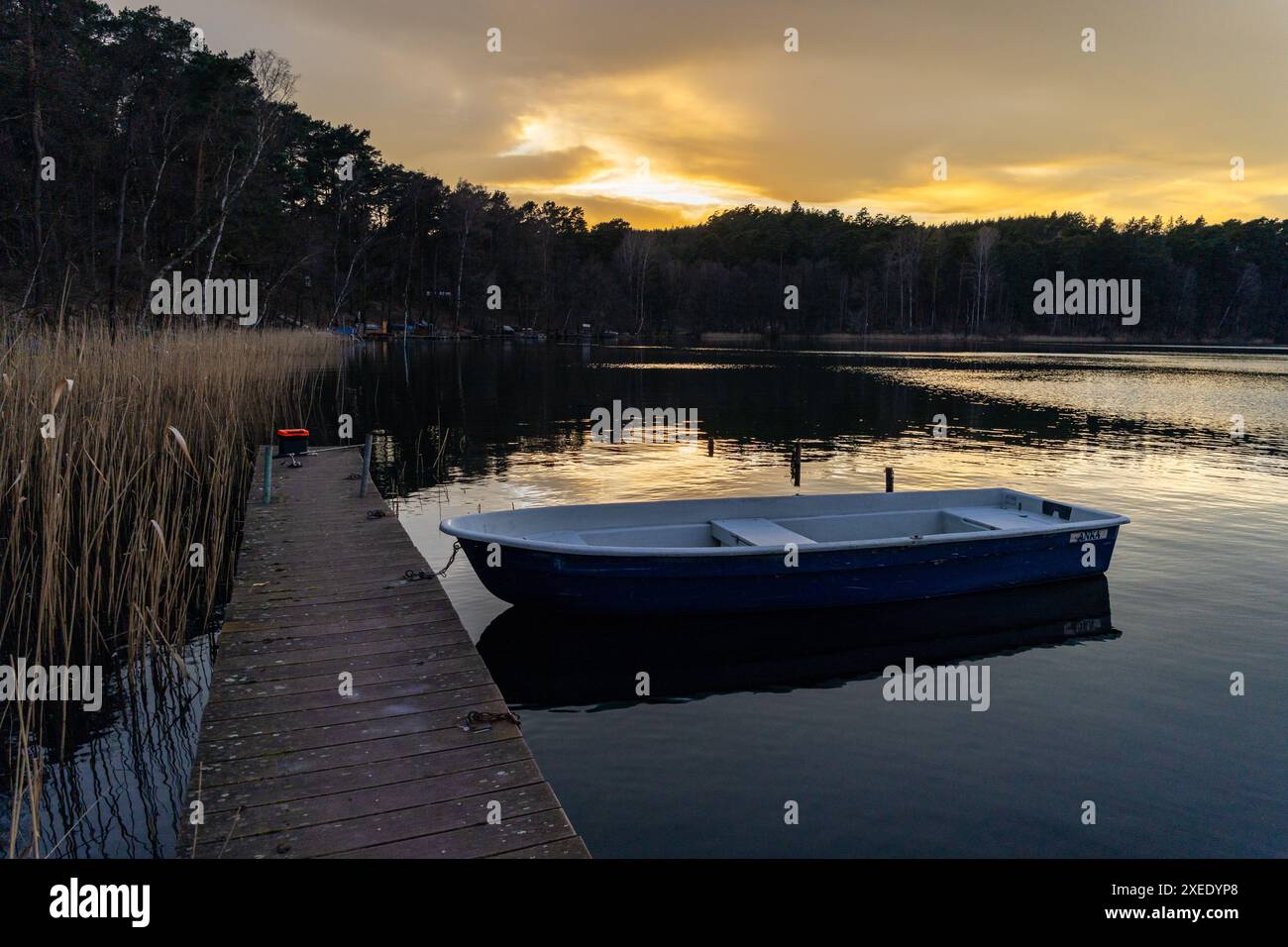 Fully flooded fishing boat in the lake Stock Photo - Alamy