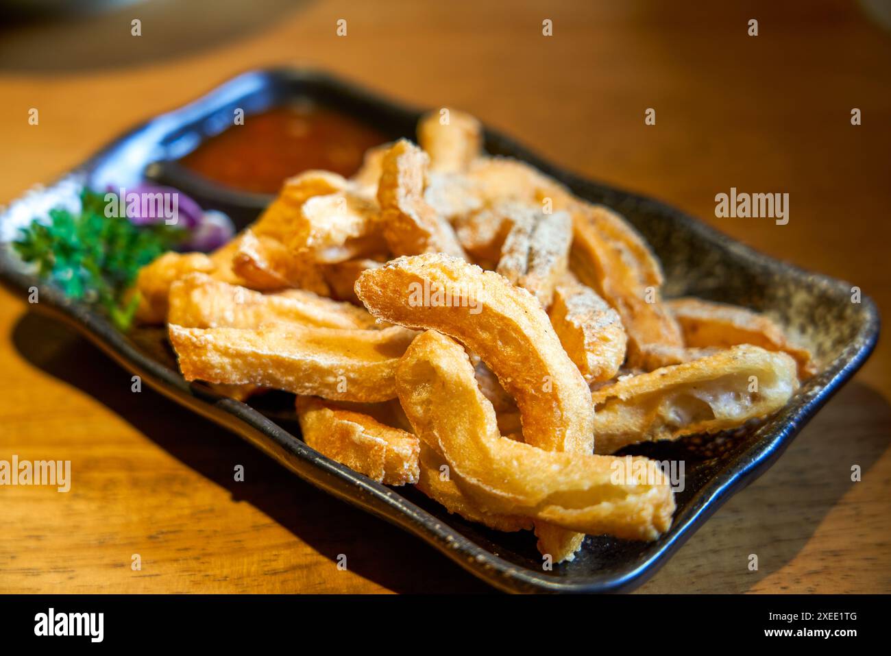 A plate of crispy and delicious Taiwanese snacks, sweet and spicy Stock ...