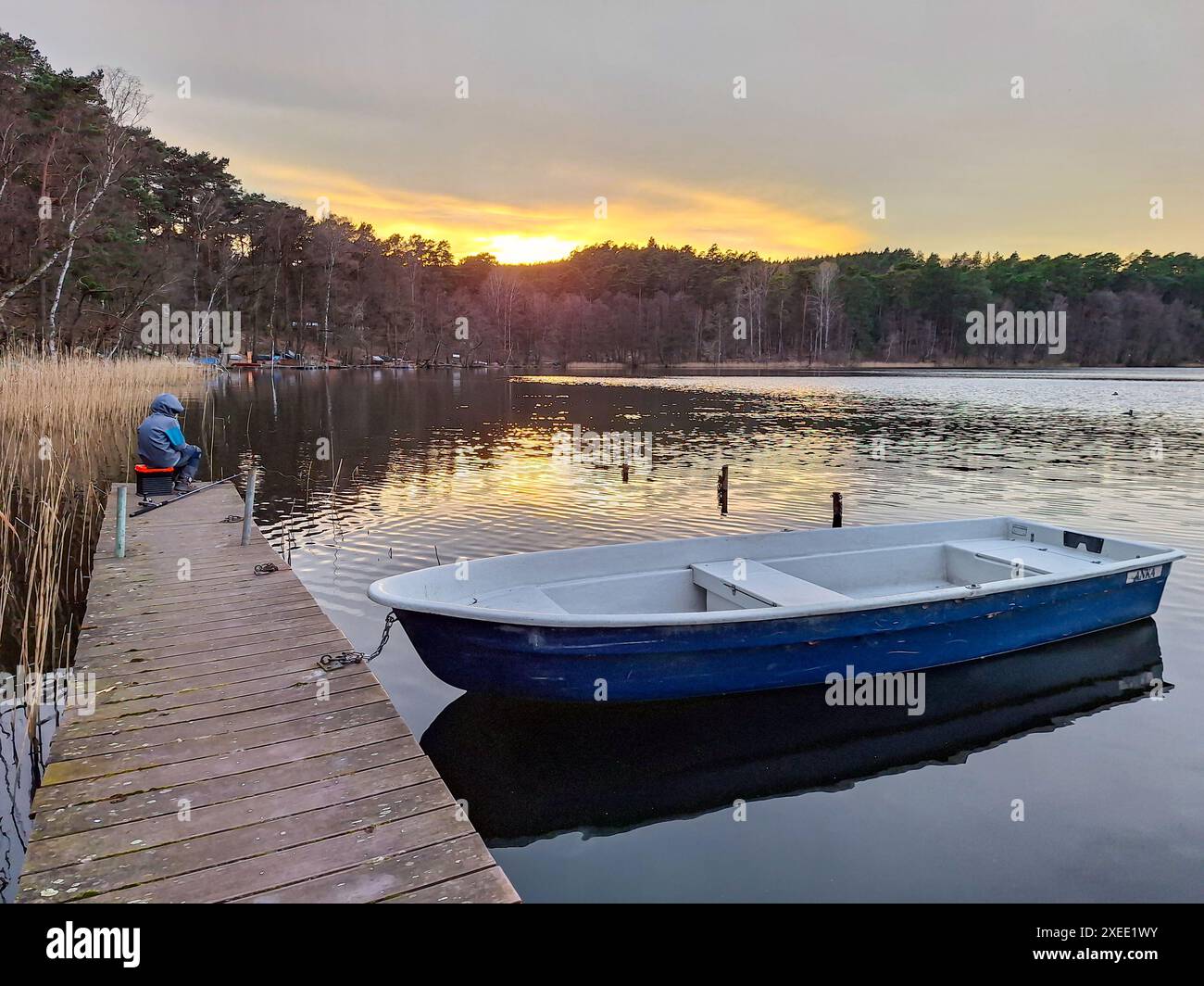 Fully flooded fishing boat in the lake Stock Photo - Alamy