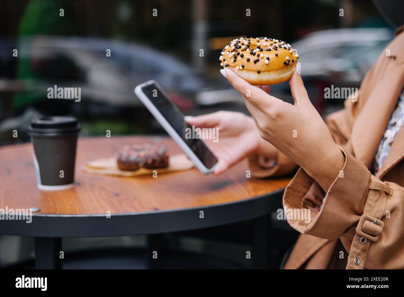 Woman eating donuts hi-res stock photography and images - Alamy