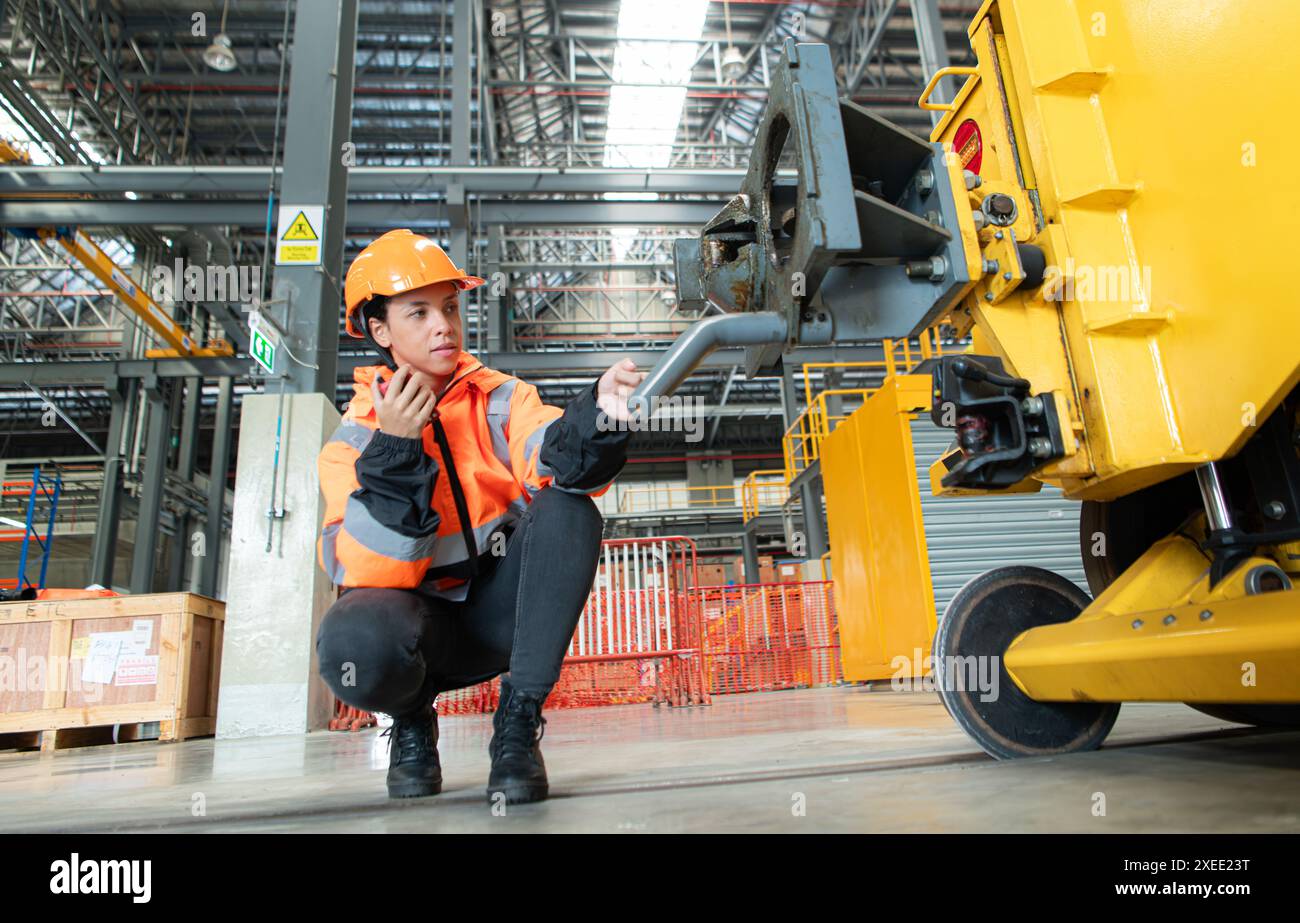 Female engineer working in electric train repair shop, Inspecting small ...