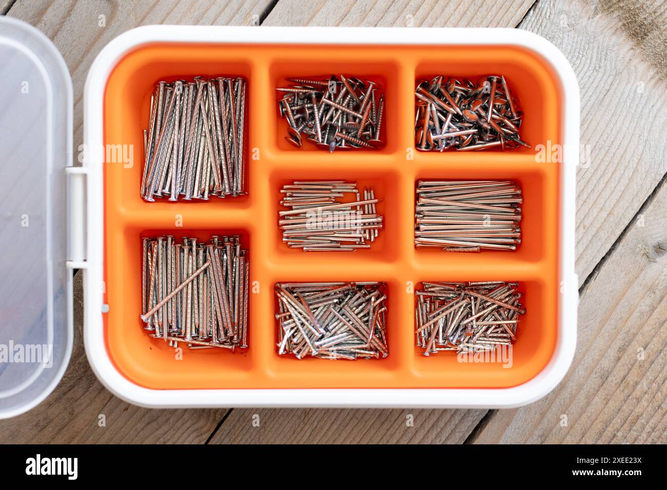 Collection of nails, screws and bolts in plastic box Stock Photo - Alamy