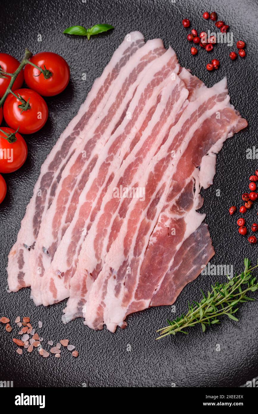 Fresh raw bacon cut into slices with salt Stock Photo - Alamy