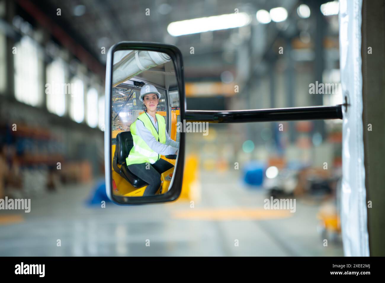 Female engineer working in electric train repair shop, Test driving a ...