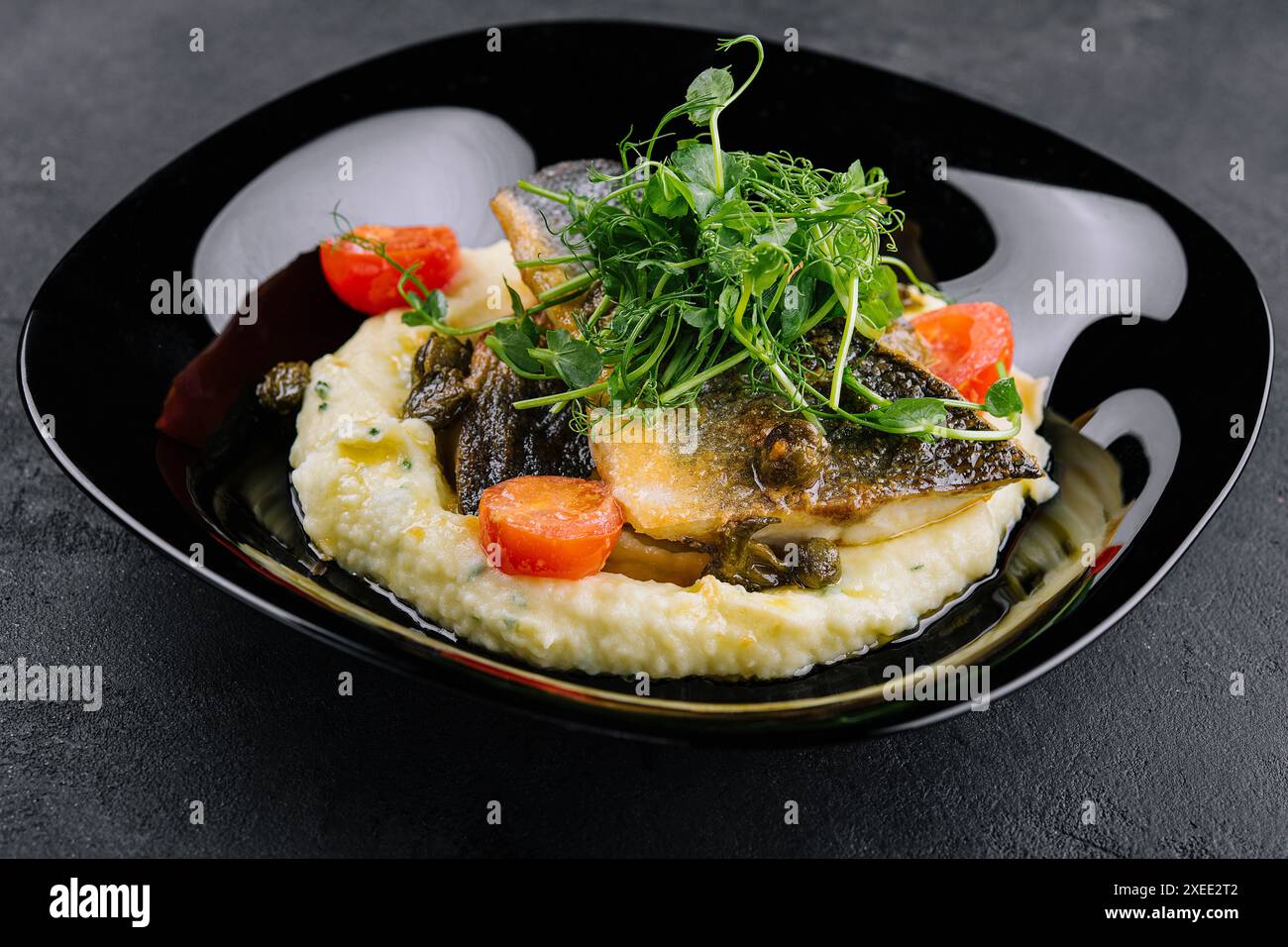 Fried norwegian skrei cod fish filet with mashed potatoes Stock Photo ...