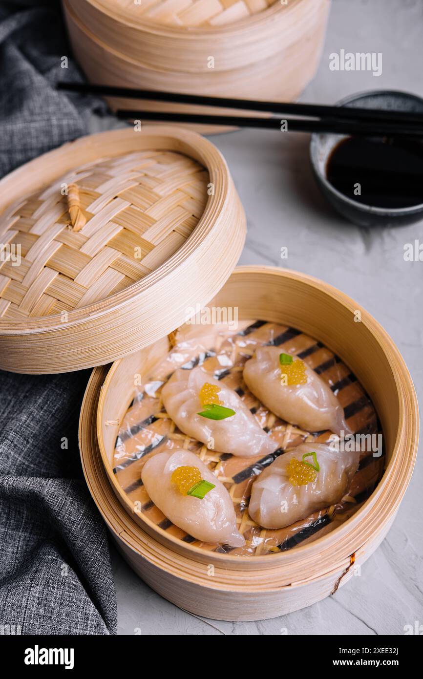 Steamed shrimp dumplings dim sum with pike caviar Stock Photo - Alamy