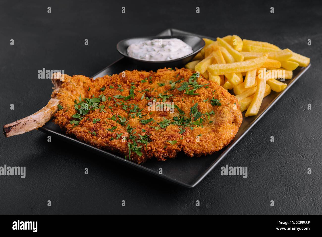 Fried wiener schnitzel from veal topside with french fries Stock Photo ...