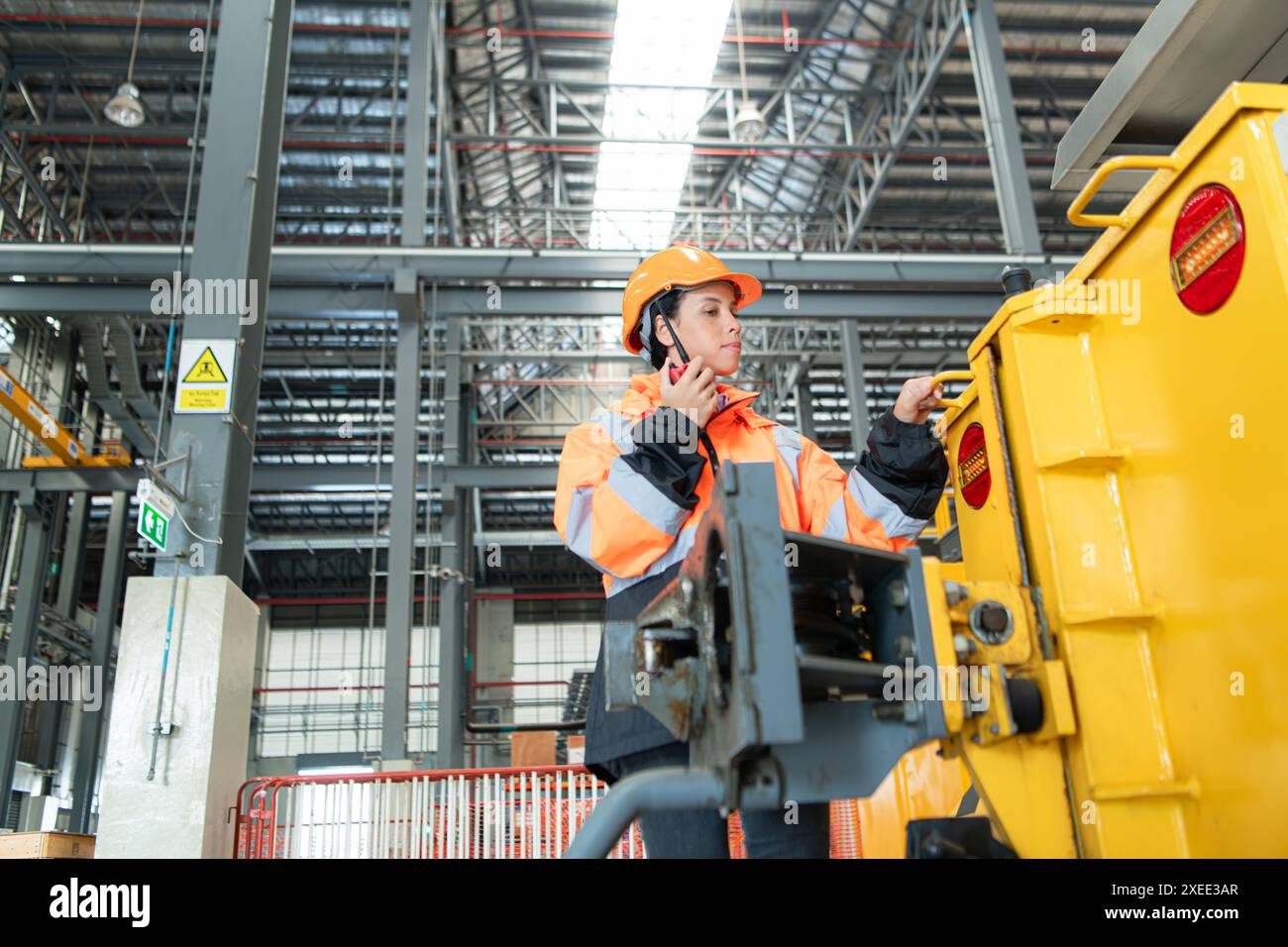Female engineer working in electric train repair shop, Inspecting small ...