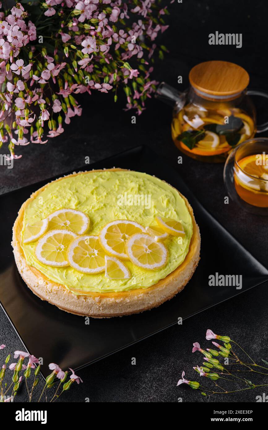 Layered Lemon Cheesecake on black plate Stock Photo - Alamy