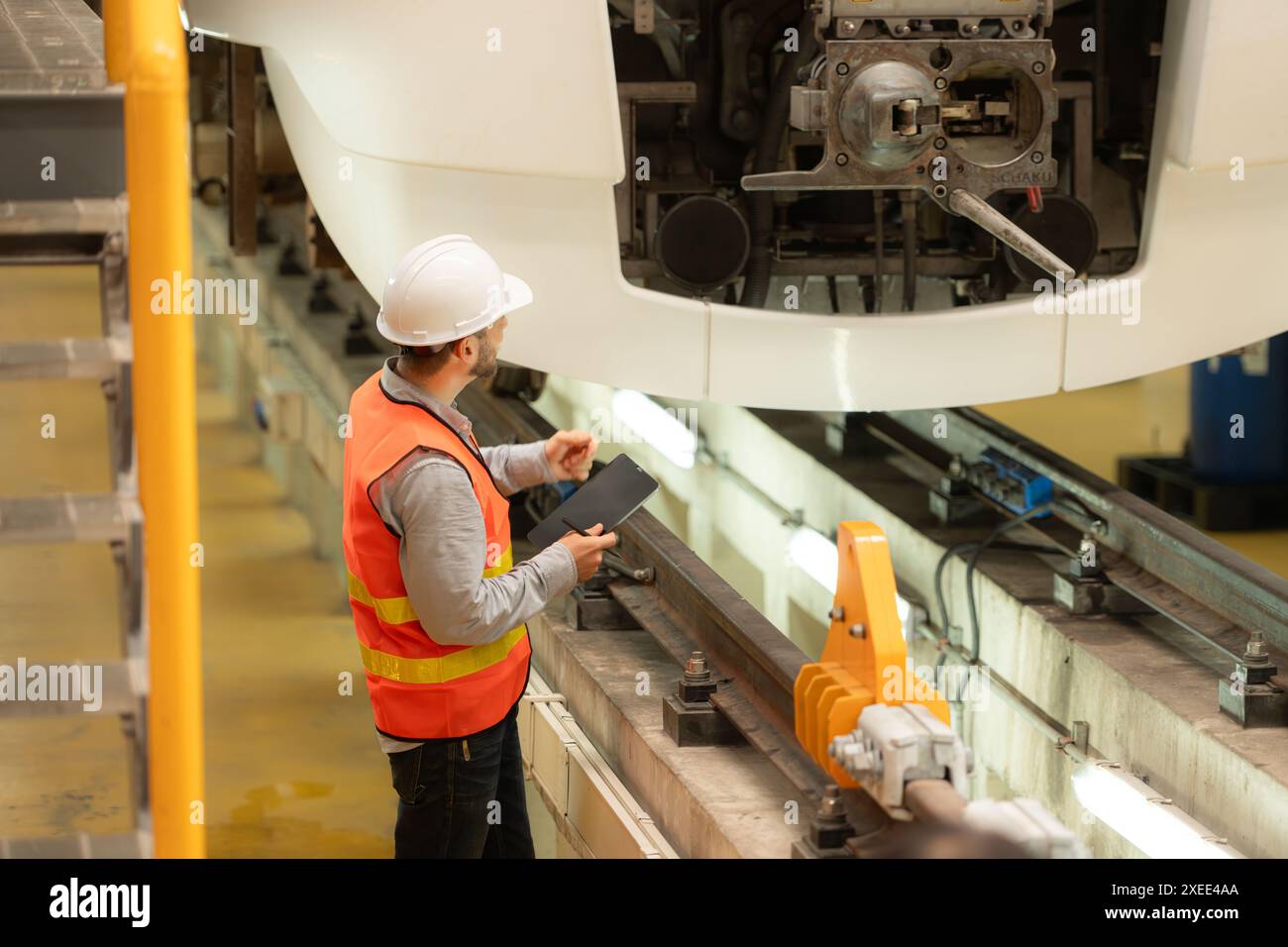 Male engineers work together in an electric repair station. Inspect ...